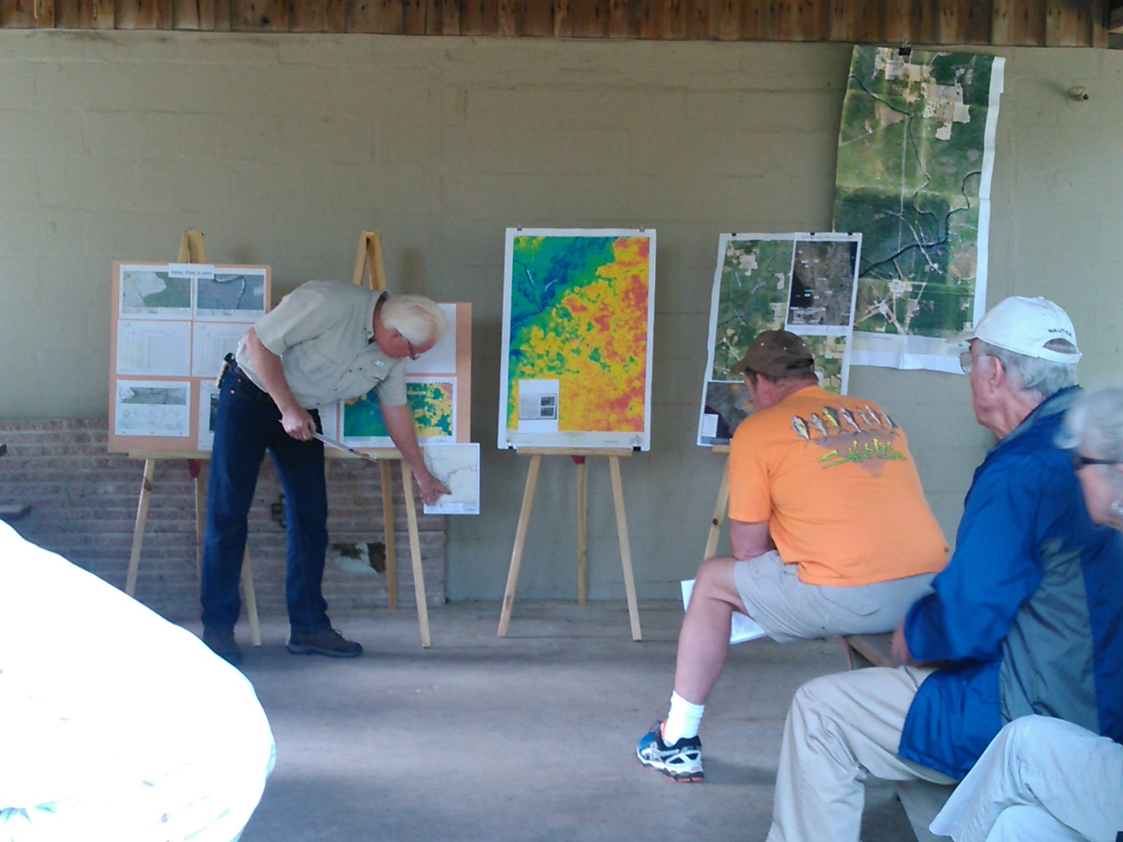 Chris Mericle showing Rep. Ted Yoho two geological reports about ...